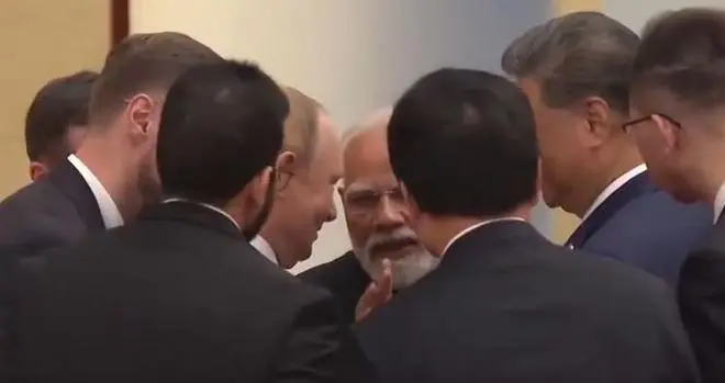 Modi, Putin share warm hug; Xi joins talks ahead of SCO plenary - The Hindu BusinessLine